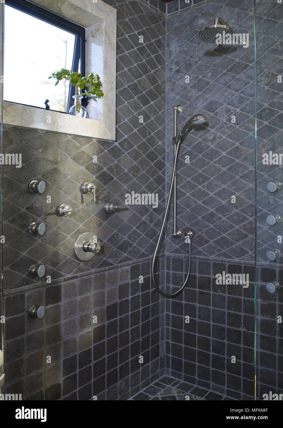 Tiled shower area in modern bathroom Stock Photo - Alamy