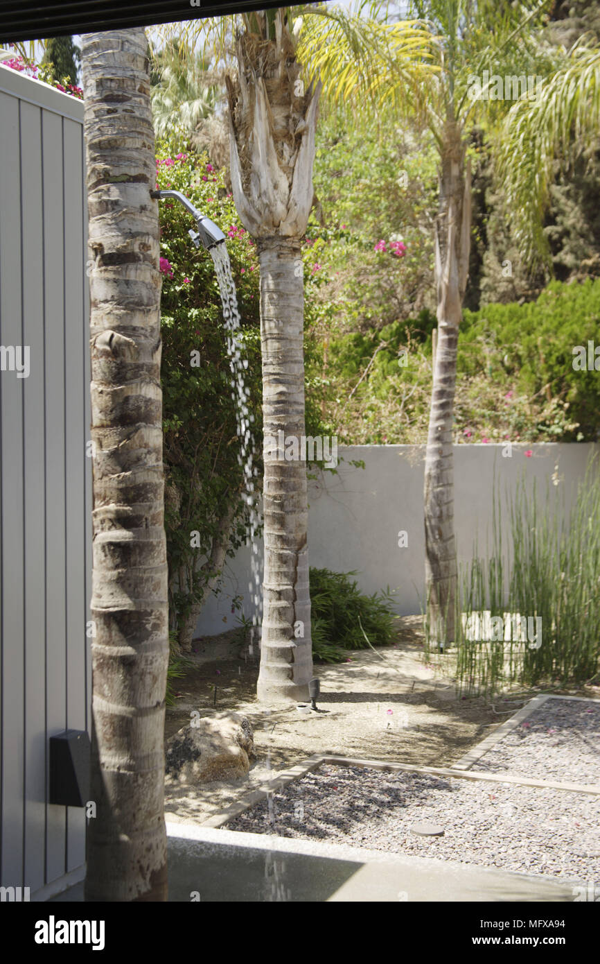 Water running from outdoor shower head affixed to tree Stock Photo - Alamy