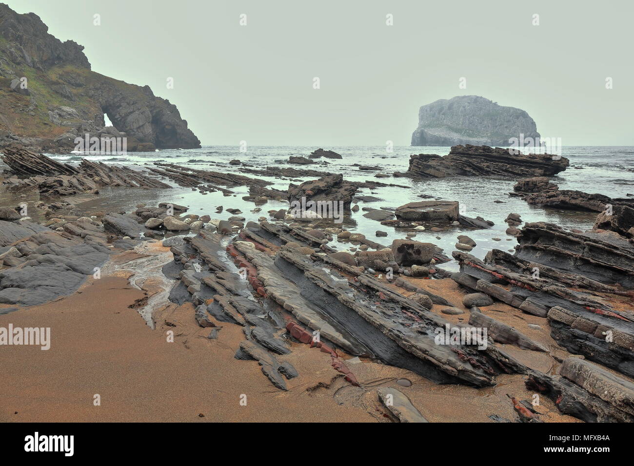 Aketx island to the east of Gaztelugatxe islet across Senaia Kala-cove ...
