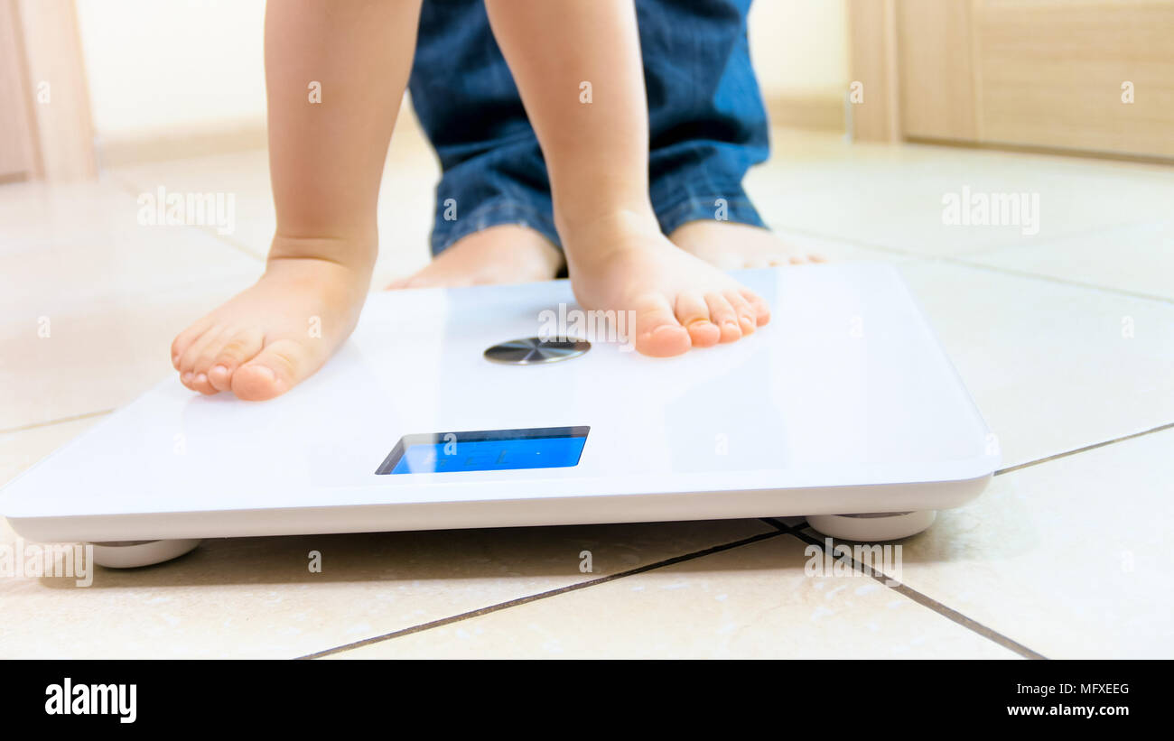 Woman weight loss scale baby hi-res stock photography and images - Alamy