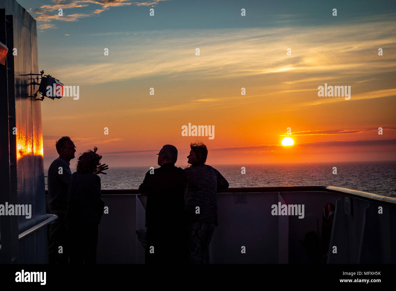 Pssengers watching July Sunset Crossing the Arctic Circle Stock Photo ...