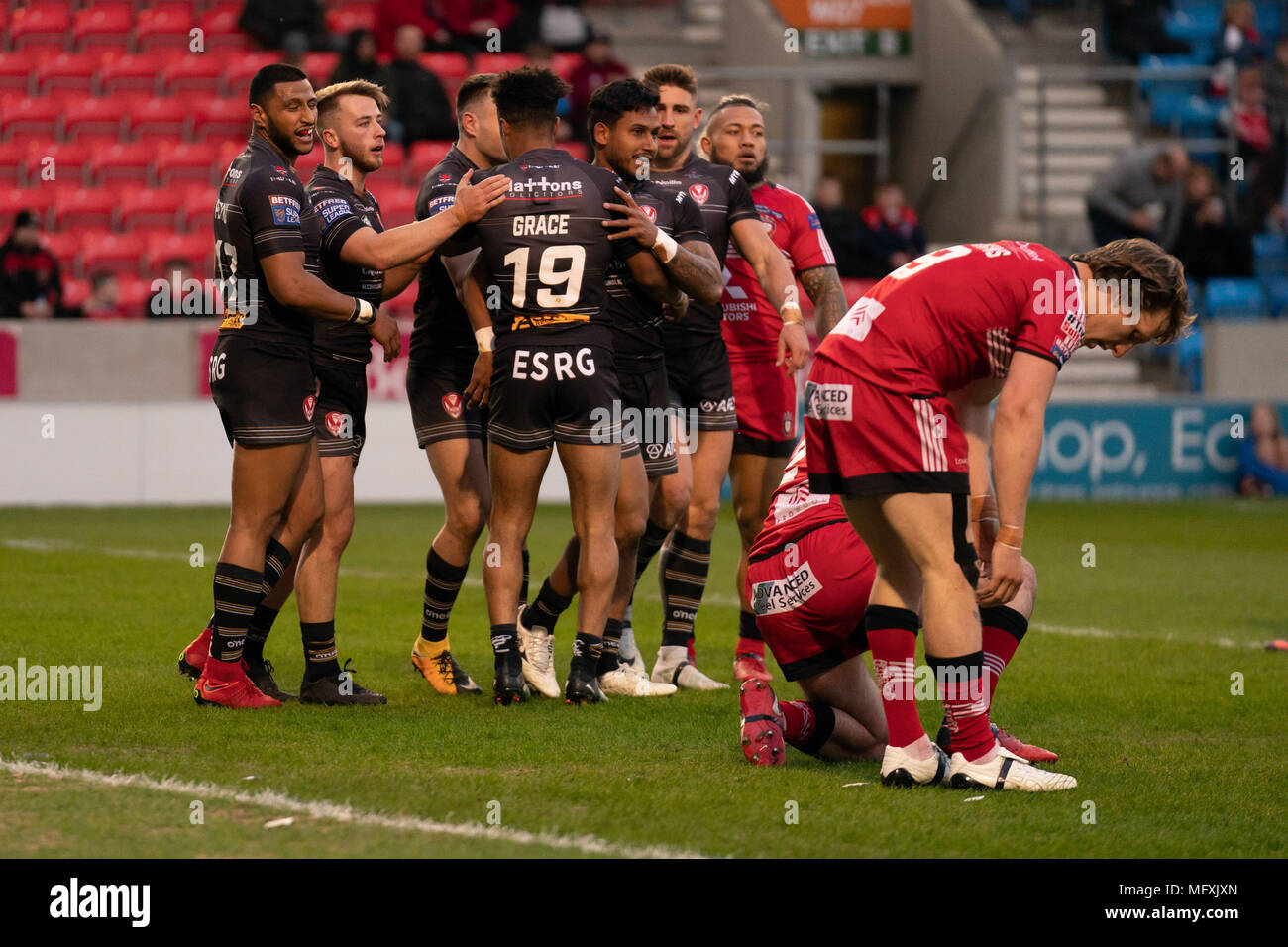 Manchester, UK. St. Helens's Regan Grace celebrates scoring his sides ...