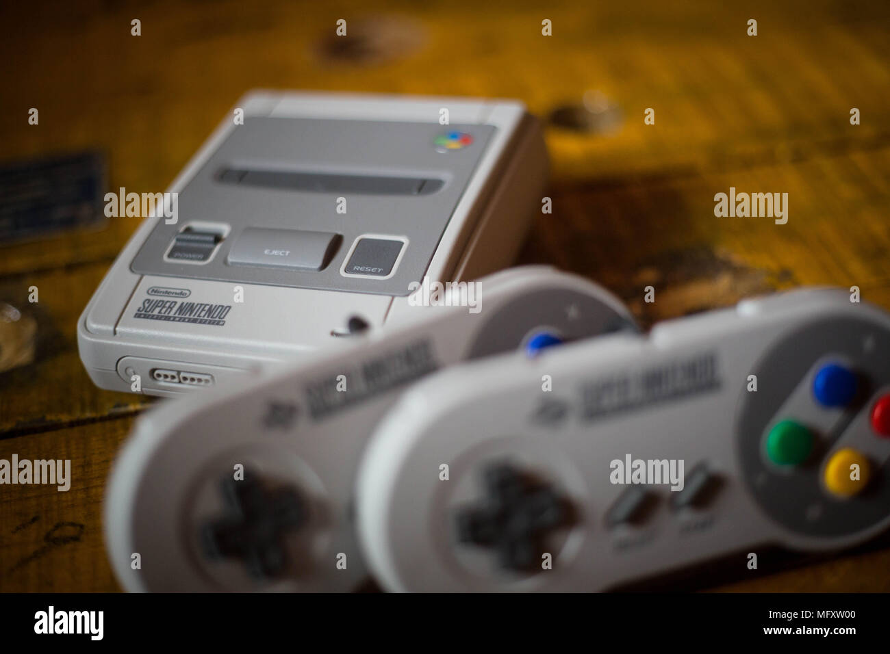 A Nintendo Classic Mini 'Super Nintendo' video game console with two ...