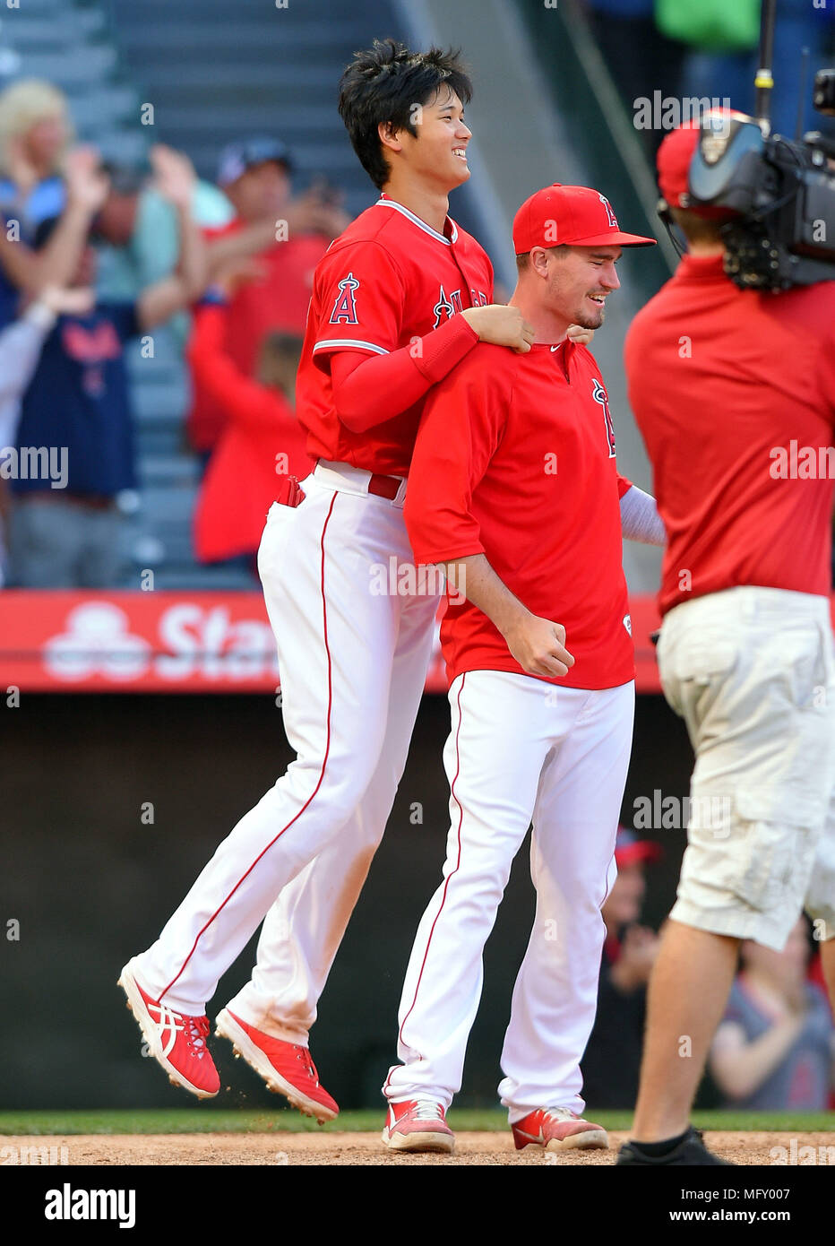 Los Angeles Angels designated hitter Shohei Ohtani (L) celebrates his ...