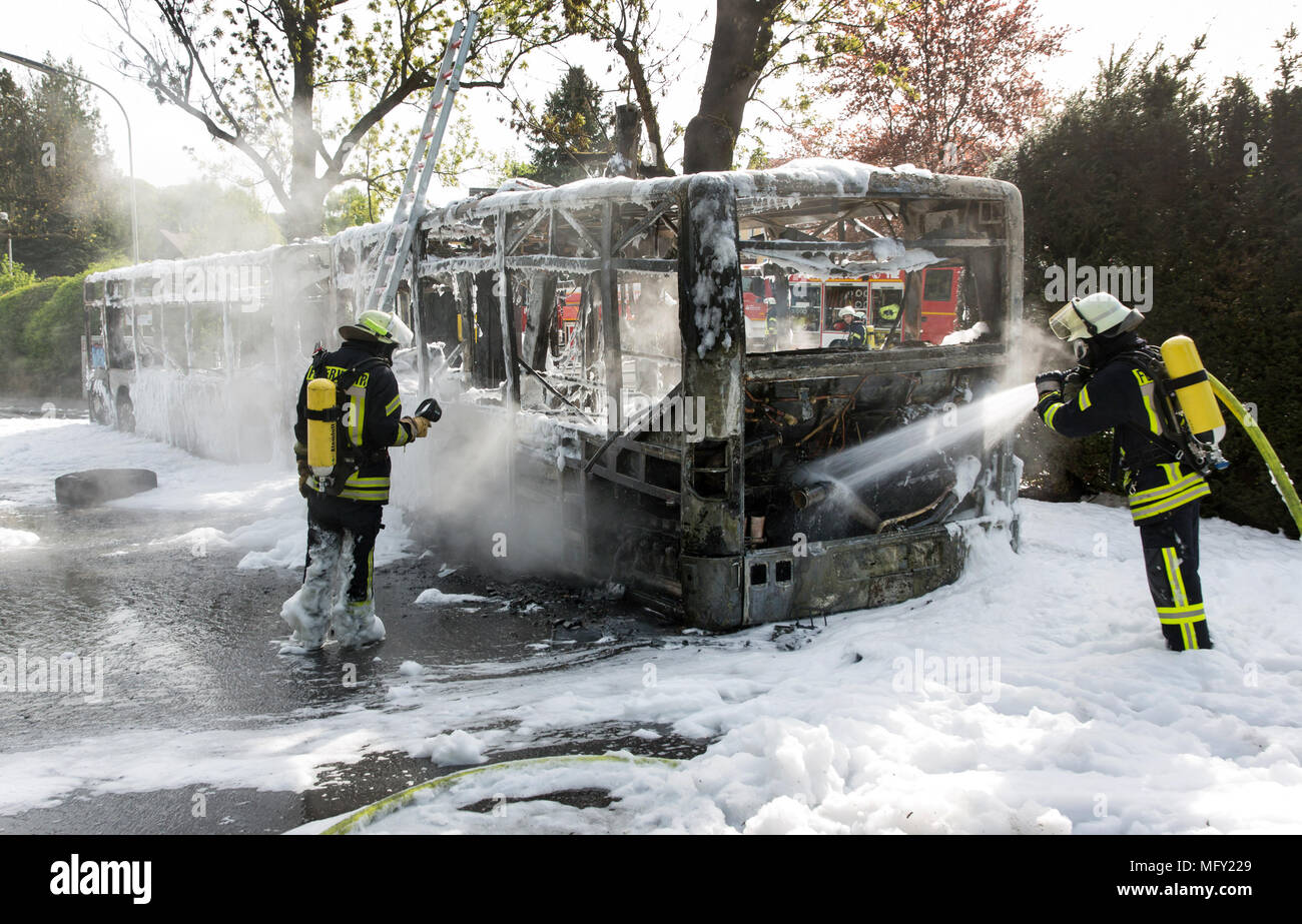 27 April 2018, Germany, Koenigswinter: Firefighters standing next to a ...