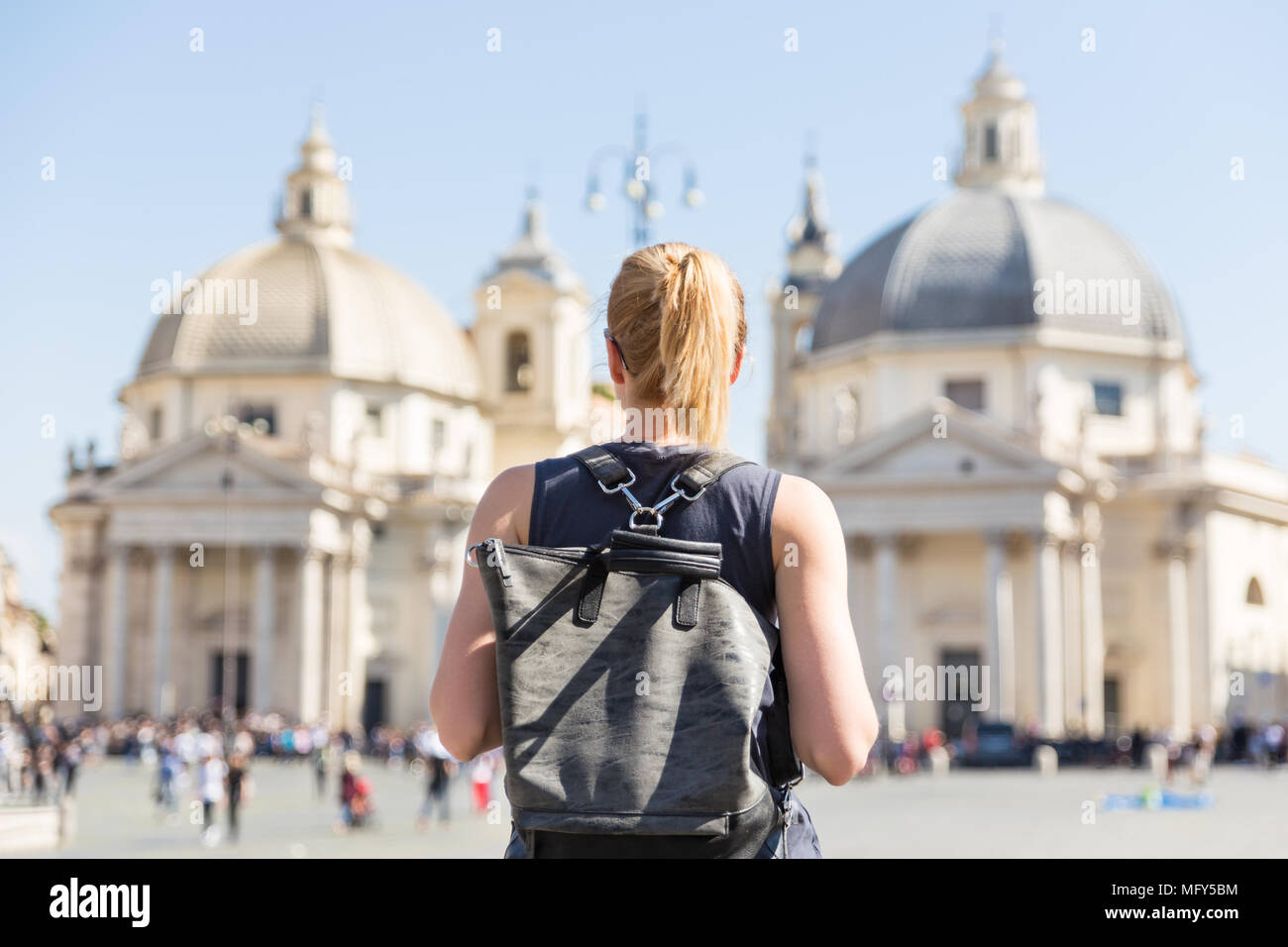 Female tourist with a fashinable vintage hipster backpack on Piazza del ...