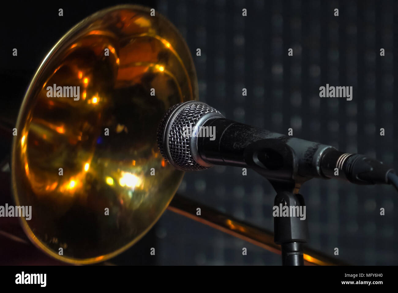 Trombone in front of a microphone Stock Photo - Alamy