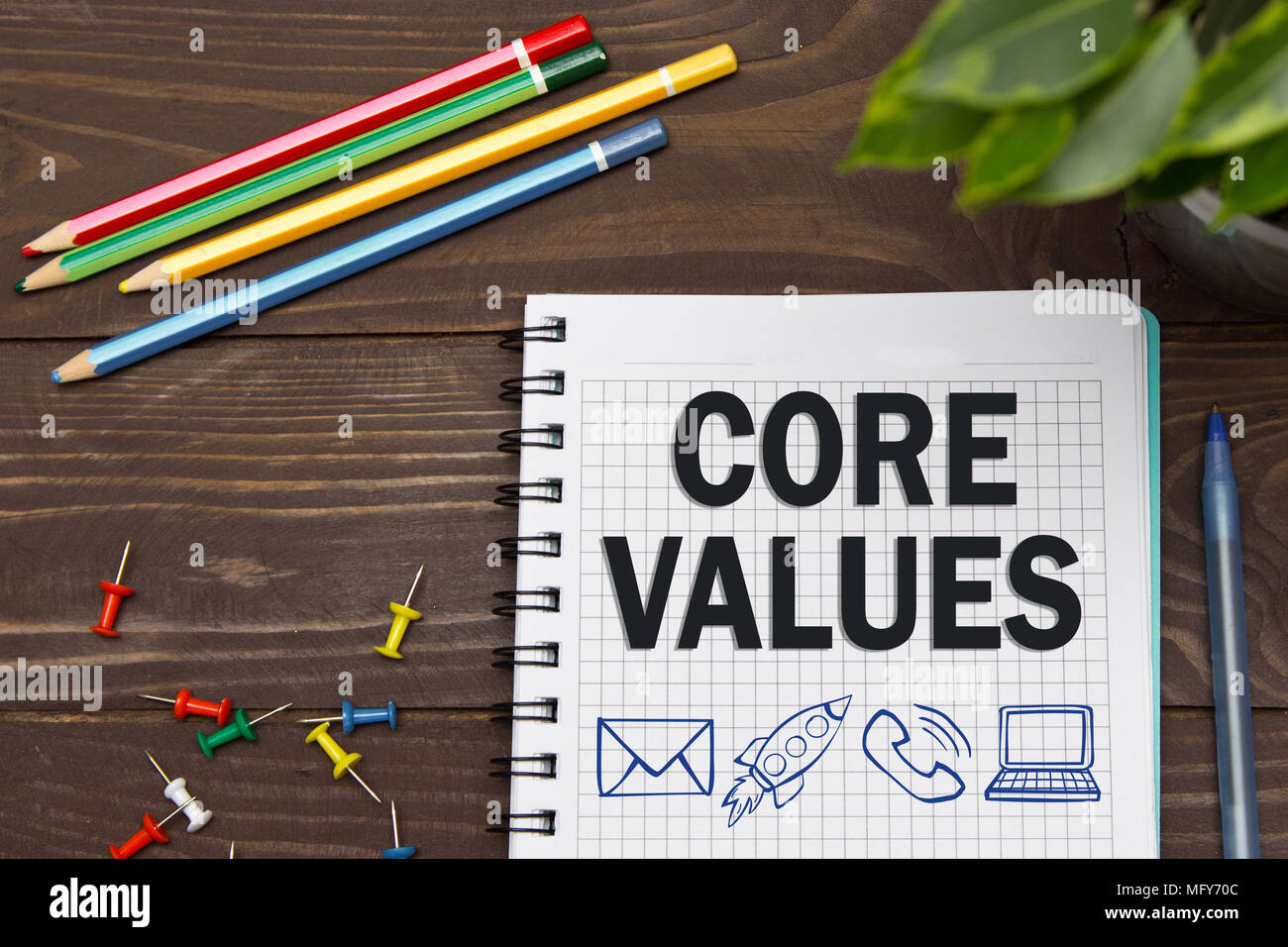 Notebook with a Business notes CORE VALUES on the office table with ...