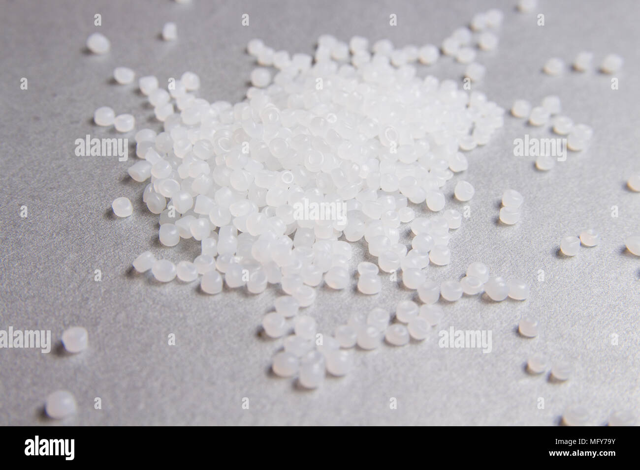 Polypropylene transparent granules on the grey background Stock Photo ...