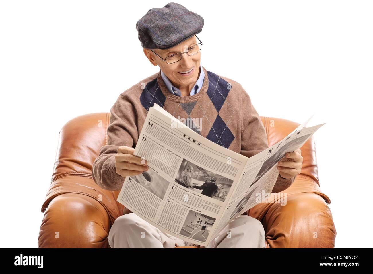Senior sitting in a leather armchair and reading a newspaper isolated ...