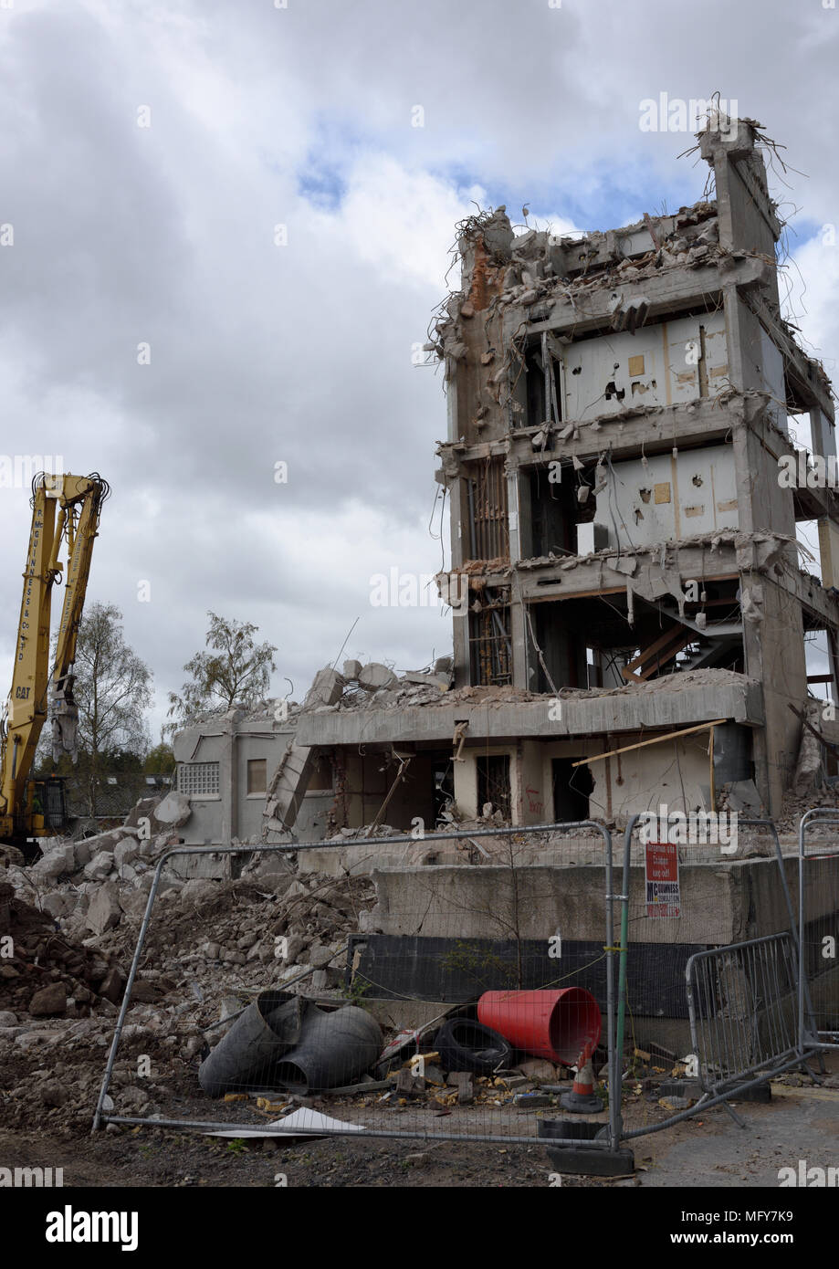 Partly demolished reinforced concrete multi storey building with ...