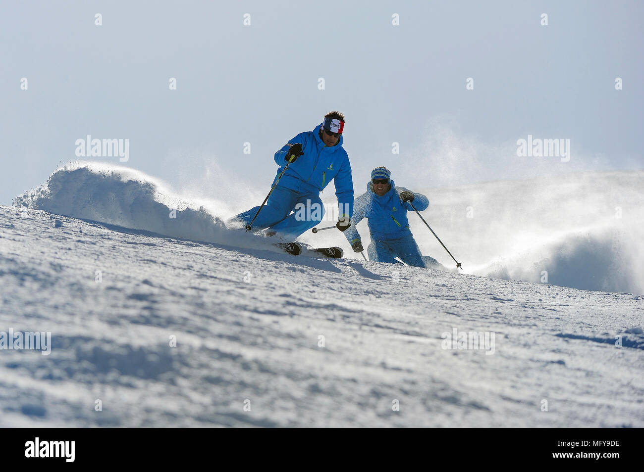 Two skiers follow each other down a piste in the French alpine resort ...