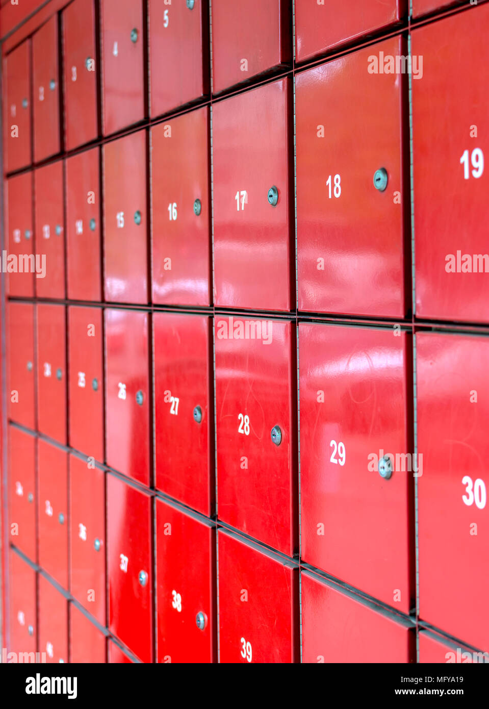 Group of red letterbox in a post office with number range. Mailbox ...