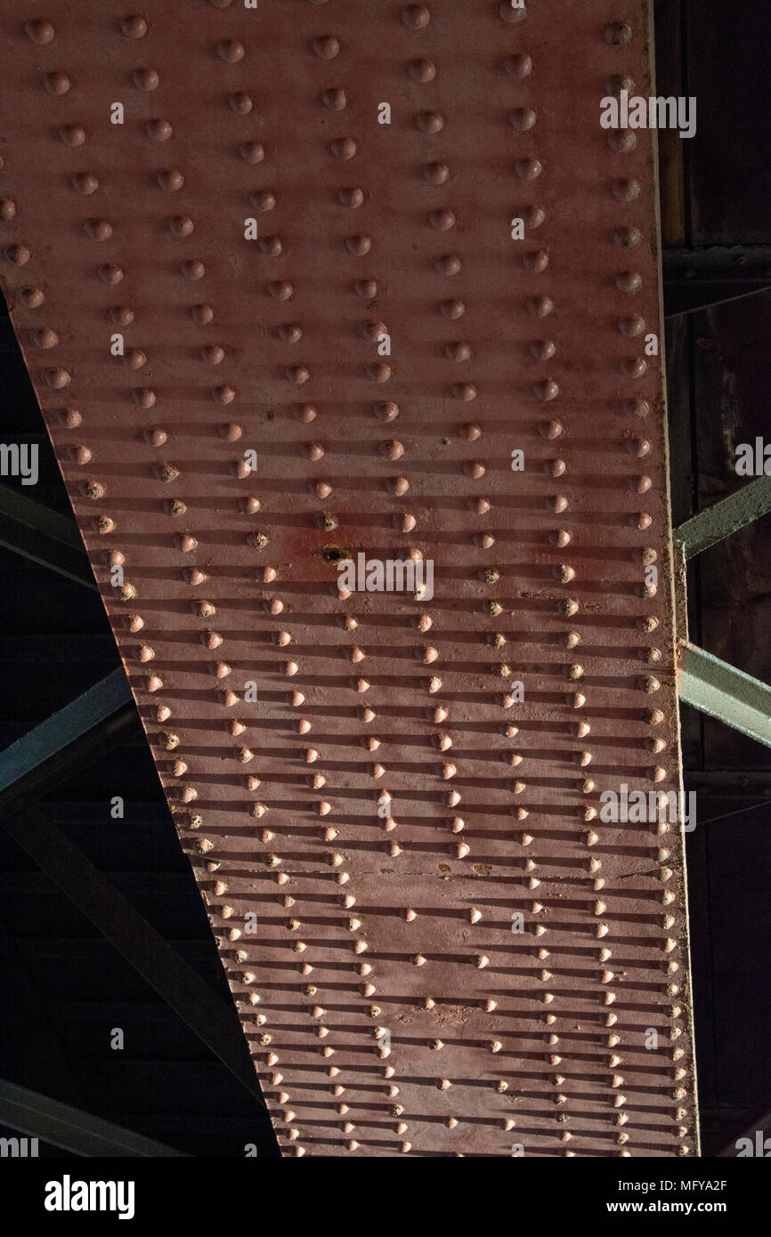 Girder and rivets on underside of railway bridge over the River Clyde ...