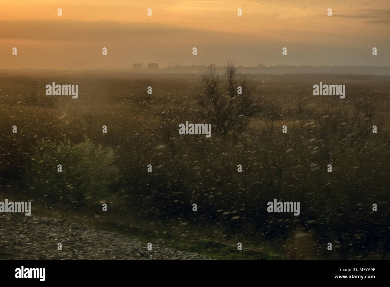 Journey in car in rainy day end of autumn. Outside window rain and snow ...