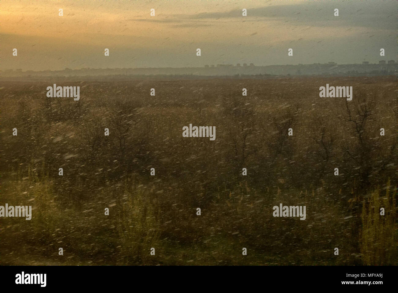 Journey in car in rainy day end of autumn. Outside window rain and snow ...