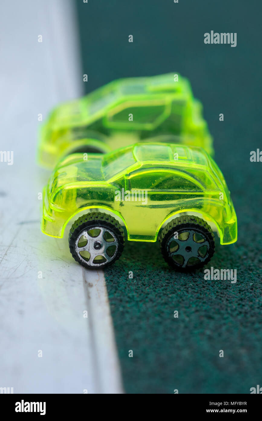green transparent plastic toy cars on starting line Stock Photo - Alamy