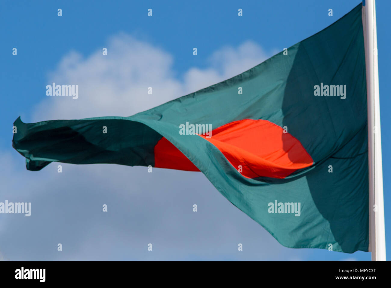 national flag of Bangladesh blowing in the wind with blue sky in ...