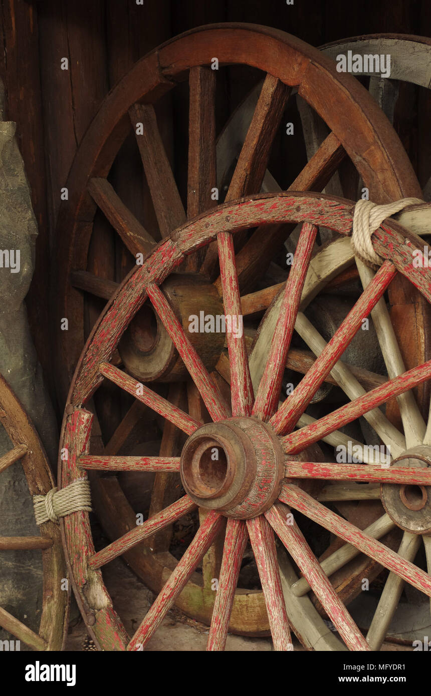 Collection of antique rustic farm wagon wheels Stock Photo - Alamy