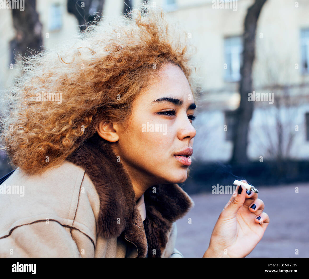 young pretty girl teenage outside smoking cigarette close up, lo Stock Photo - Alamy
