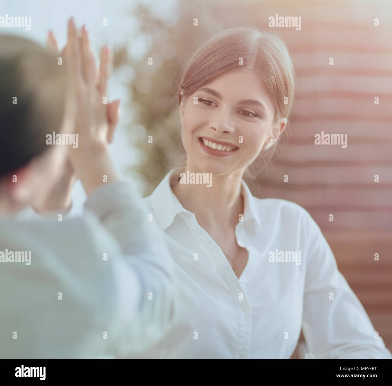 members of the business team giving each other a high five Stock Photo ...