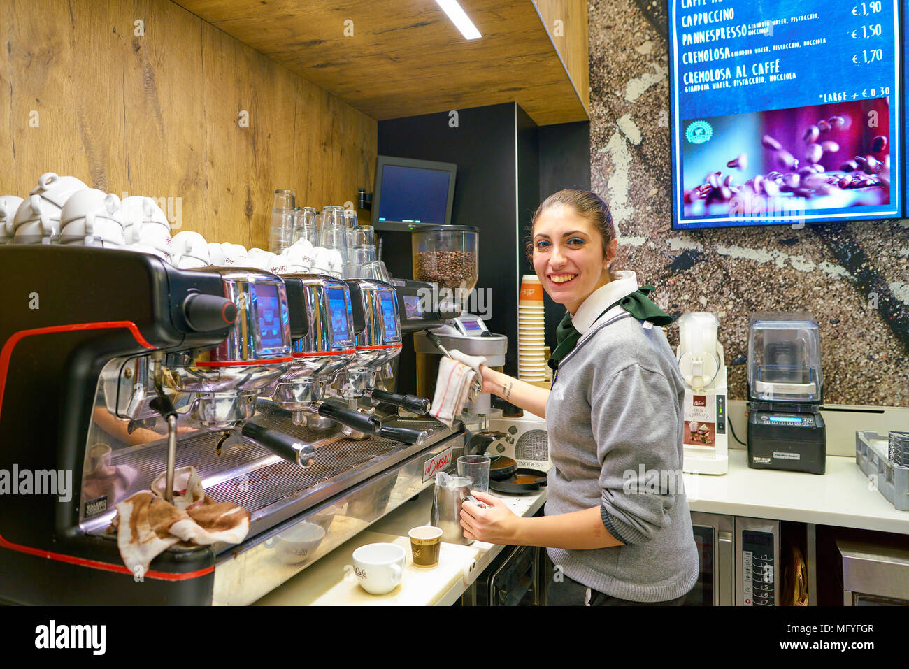 MILAN, ITALY - CIRCA NOVEMBER, 2017: worker at a McCafe coffee shop ...