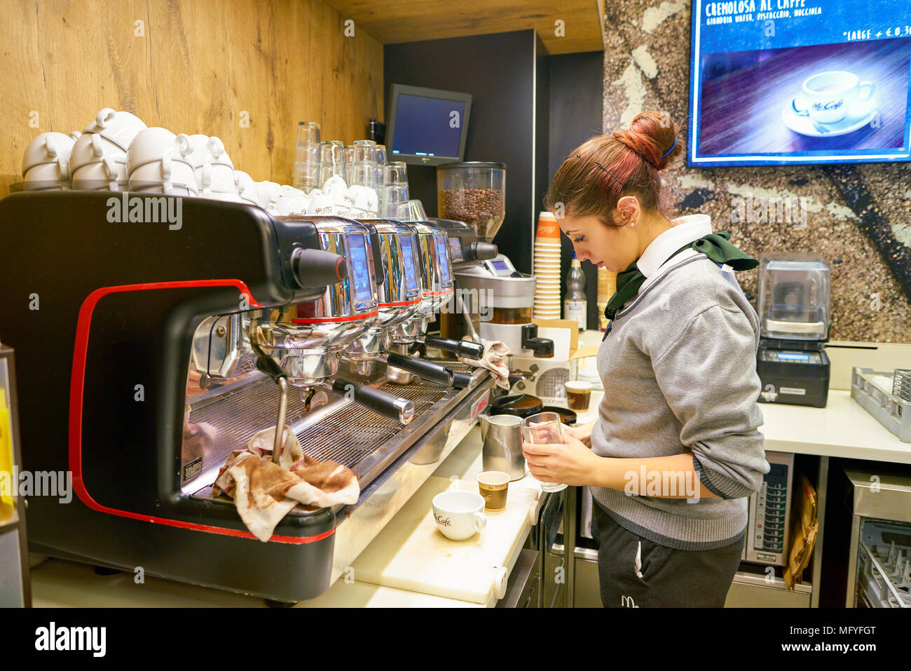 MILAN, ITALY - CIRCA NOVEMBER, 2017: worker at a McCafe coffee shop ...