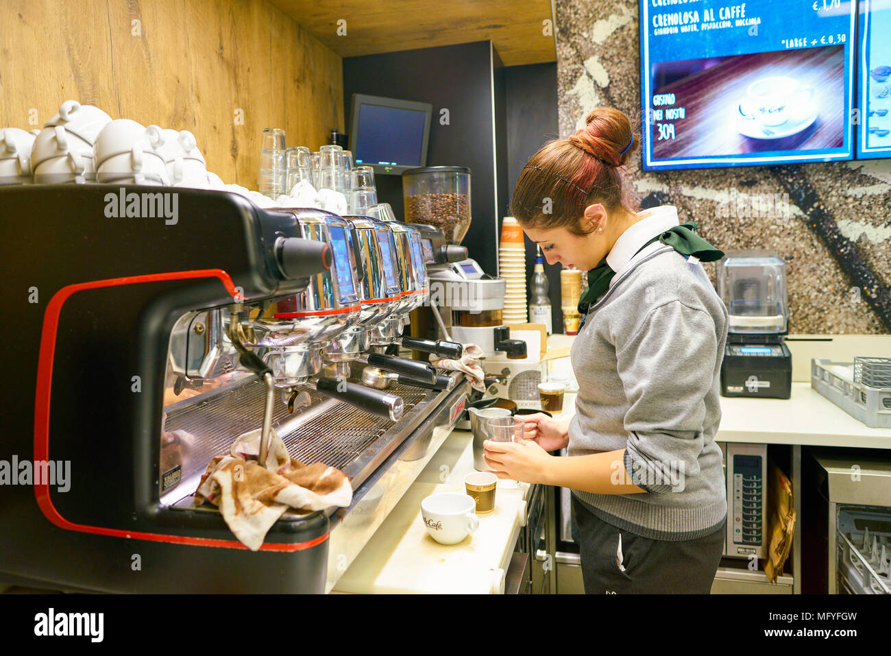 MILAN, ITALY - CIRCA NOVEMBER, 2017: worker at a McCafe coffee shop ...