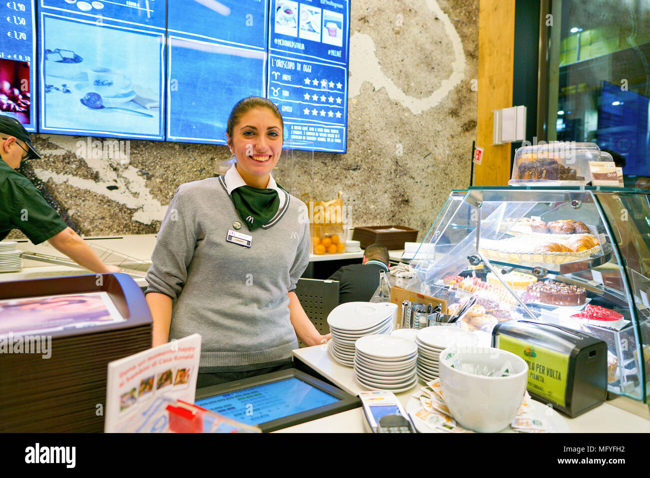MILAN, ITALY - CIRCA NOVEMBER, 2017: worker at a McCafe coffee shop ...