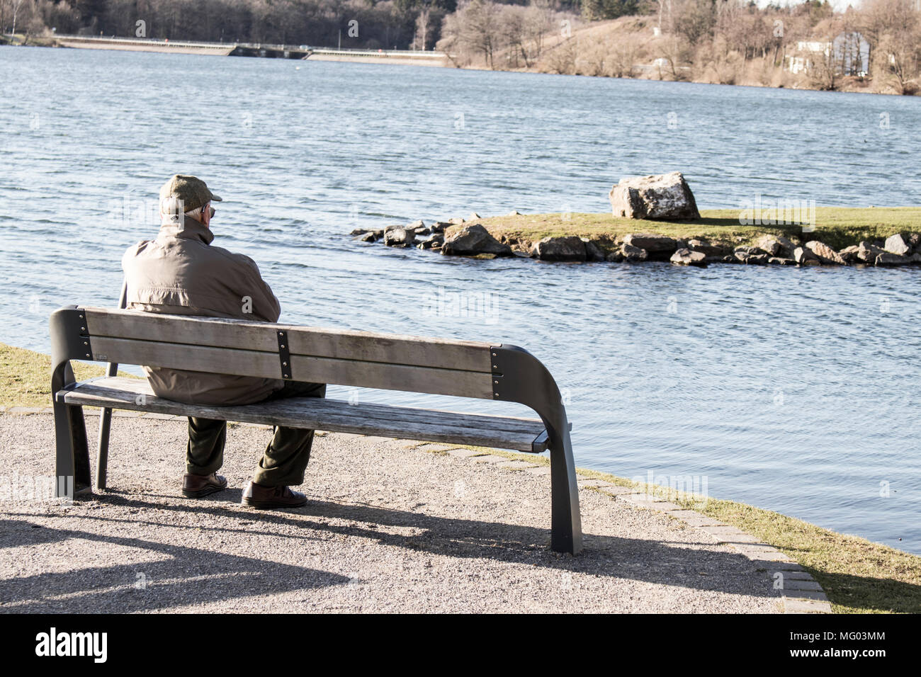 Back of man alone on park bench hi-res stock photography and images - Alamy