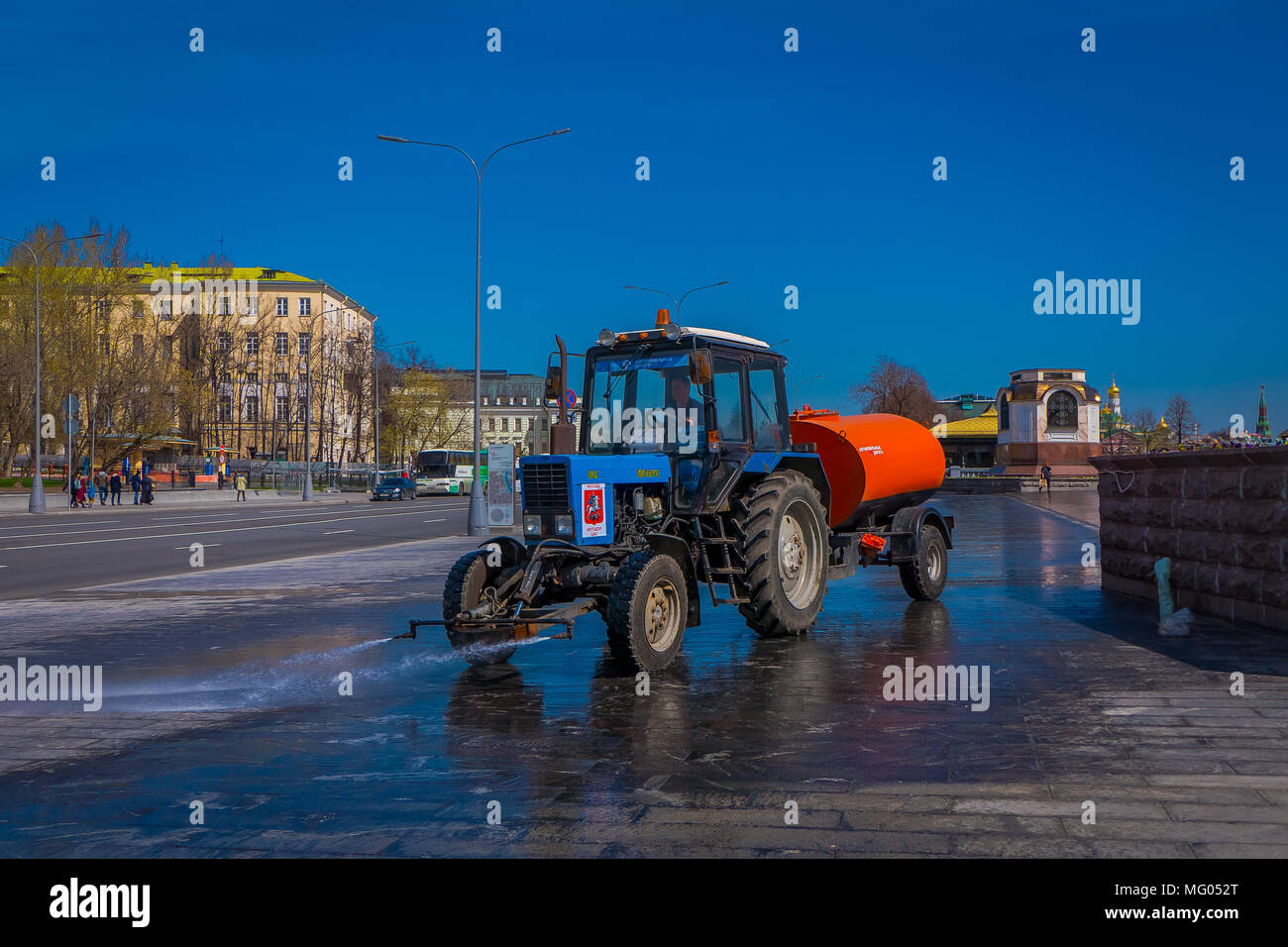 MOSCOW, RUSSIA- APRIL, 24, 2018: Outdoor view of man driving a cleaning ...