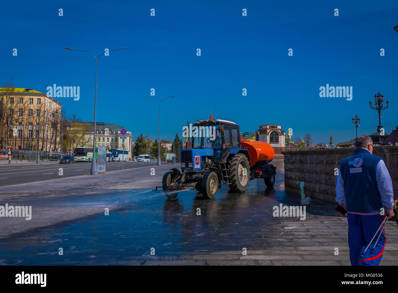MOSCOW, RUSSIA- APRIL, 24, 2018: Outdoor view of man driving a cleaning ...