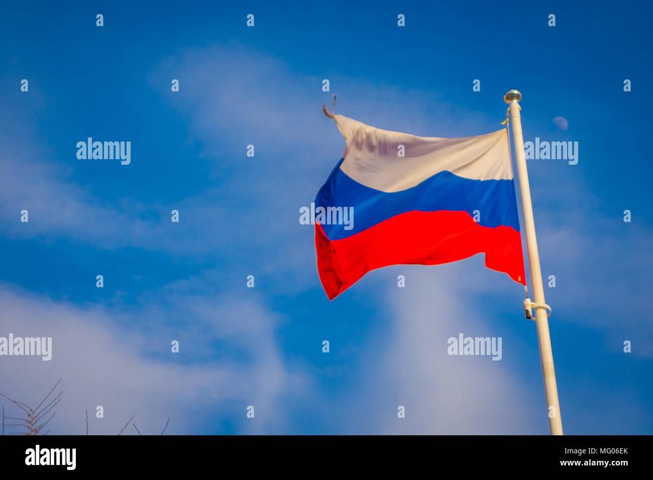 Outdoor view of russian flag waving in a blue sky background Stock ...