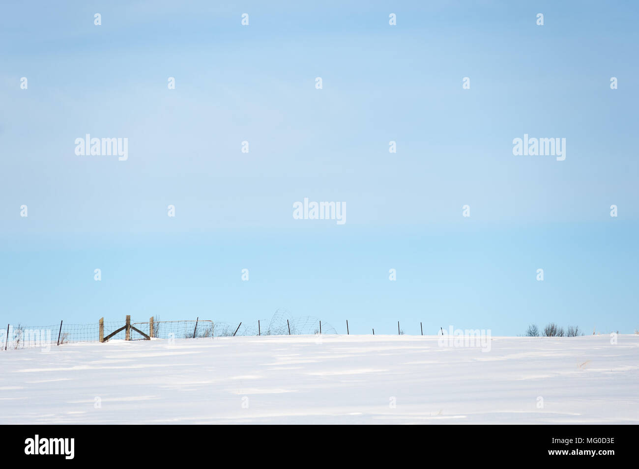 Farm fence on snow covered field Stock Photo - Alamy