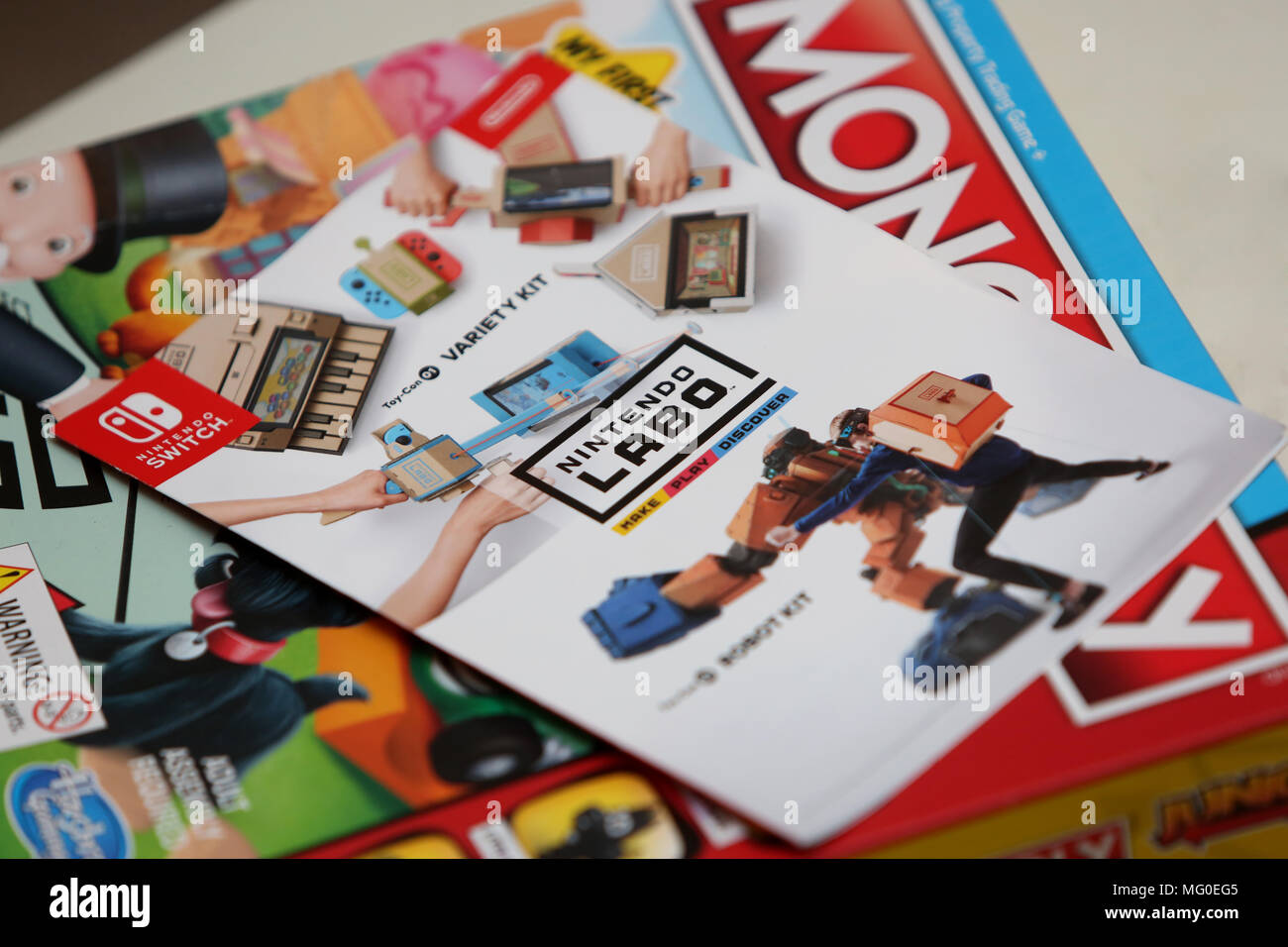 A young girl reading a Nintendo Labo document at her home in London, UK ...