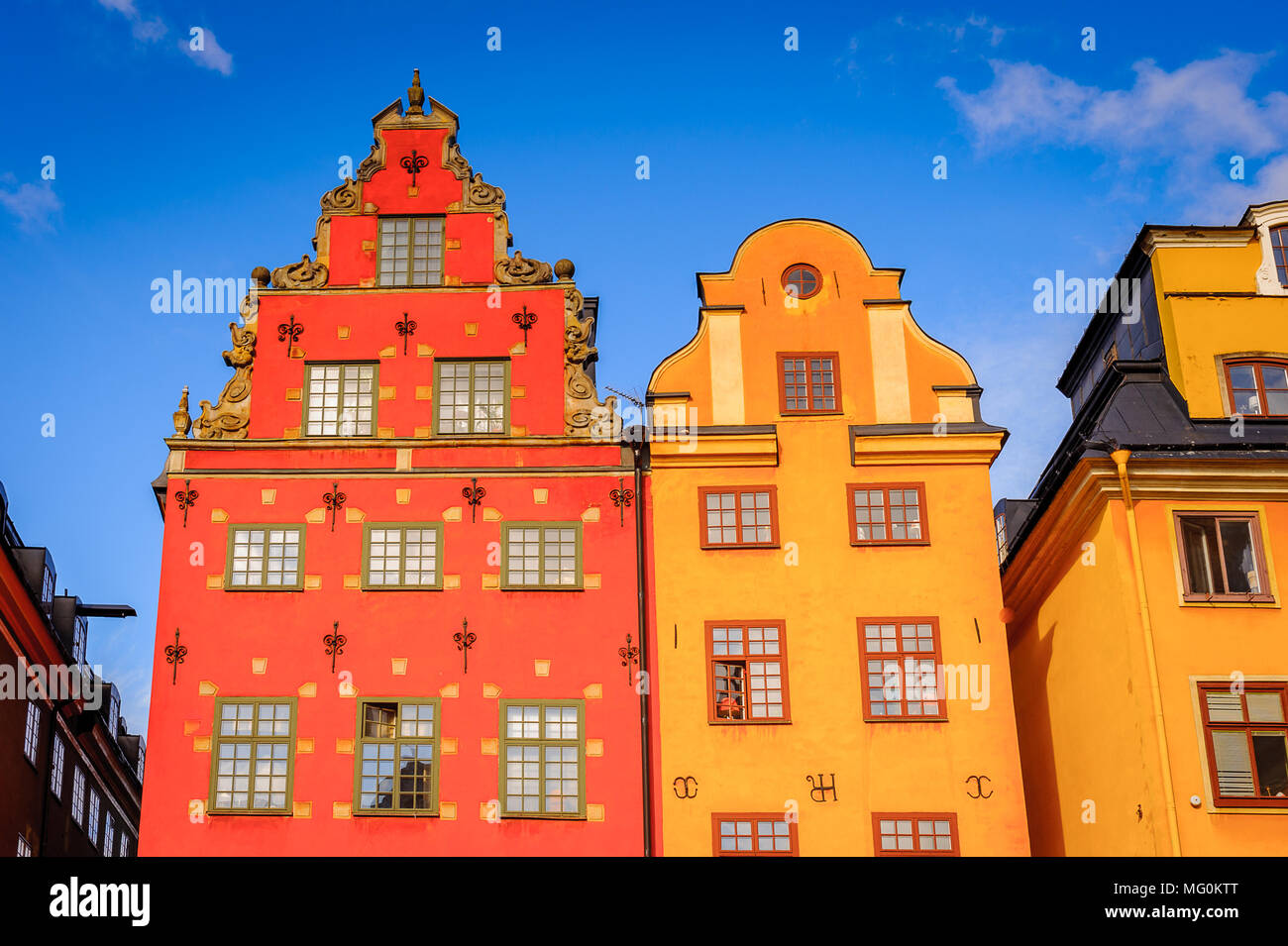 Red and Yellow iconic buildings on Stortorget, a small public square in ...