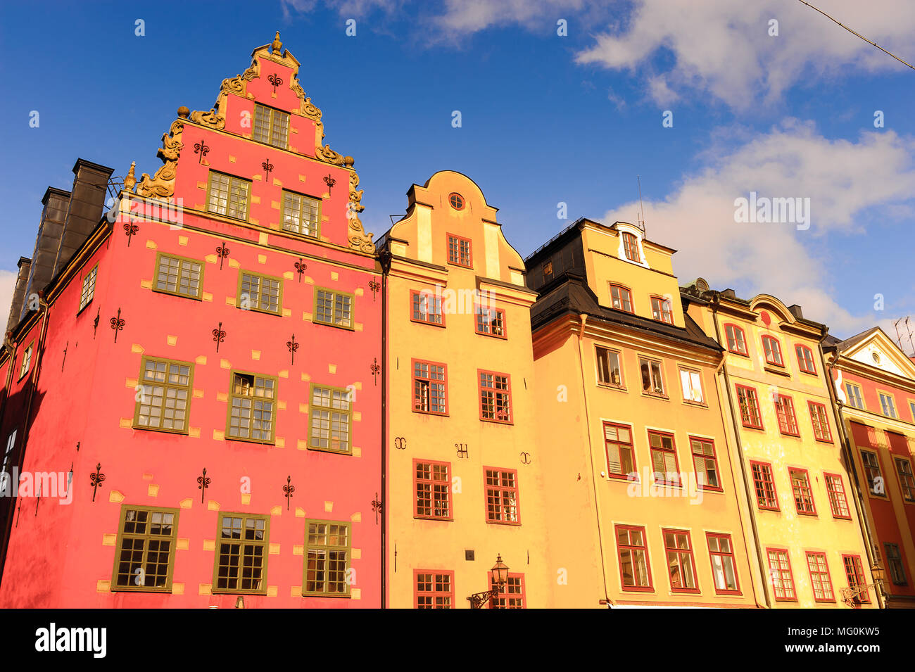 Red and Yellow iconic buildings on Stortorget, a small public square in ...