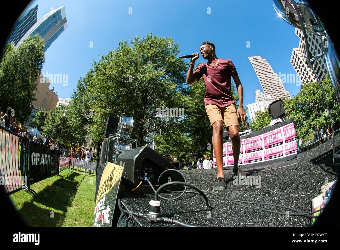 Circular fisheye perspective of unidentified male artist performing on ...