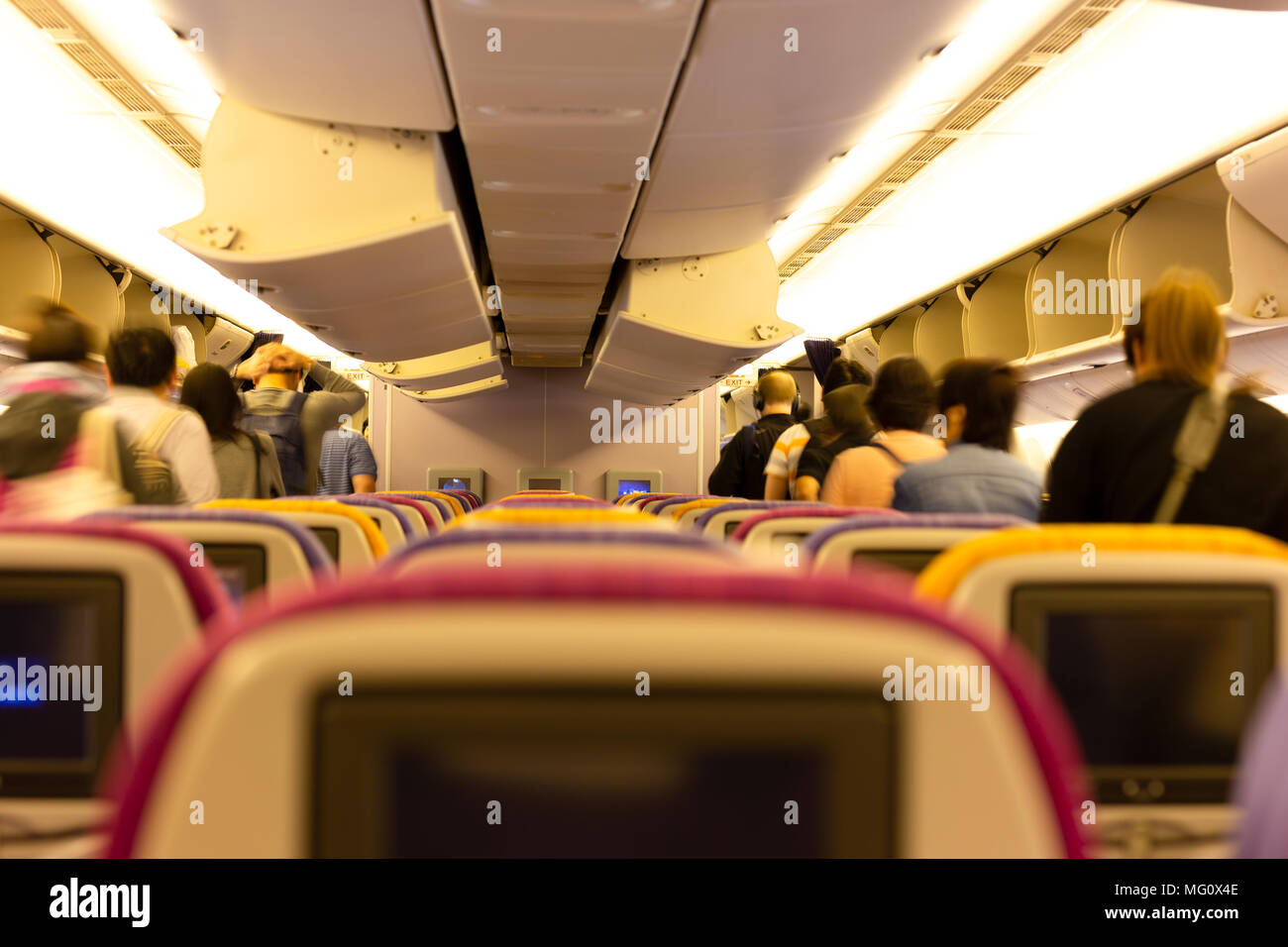 Passengers are getting off airplane on vacation Stock Photo - Alamy