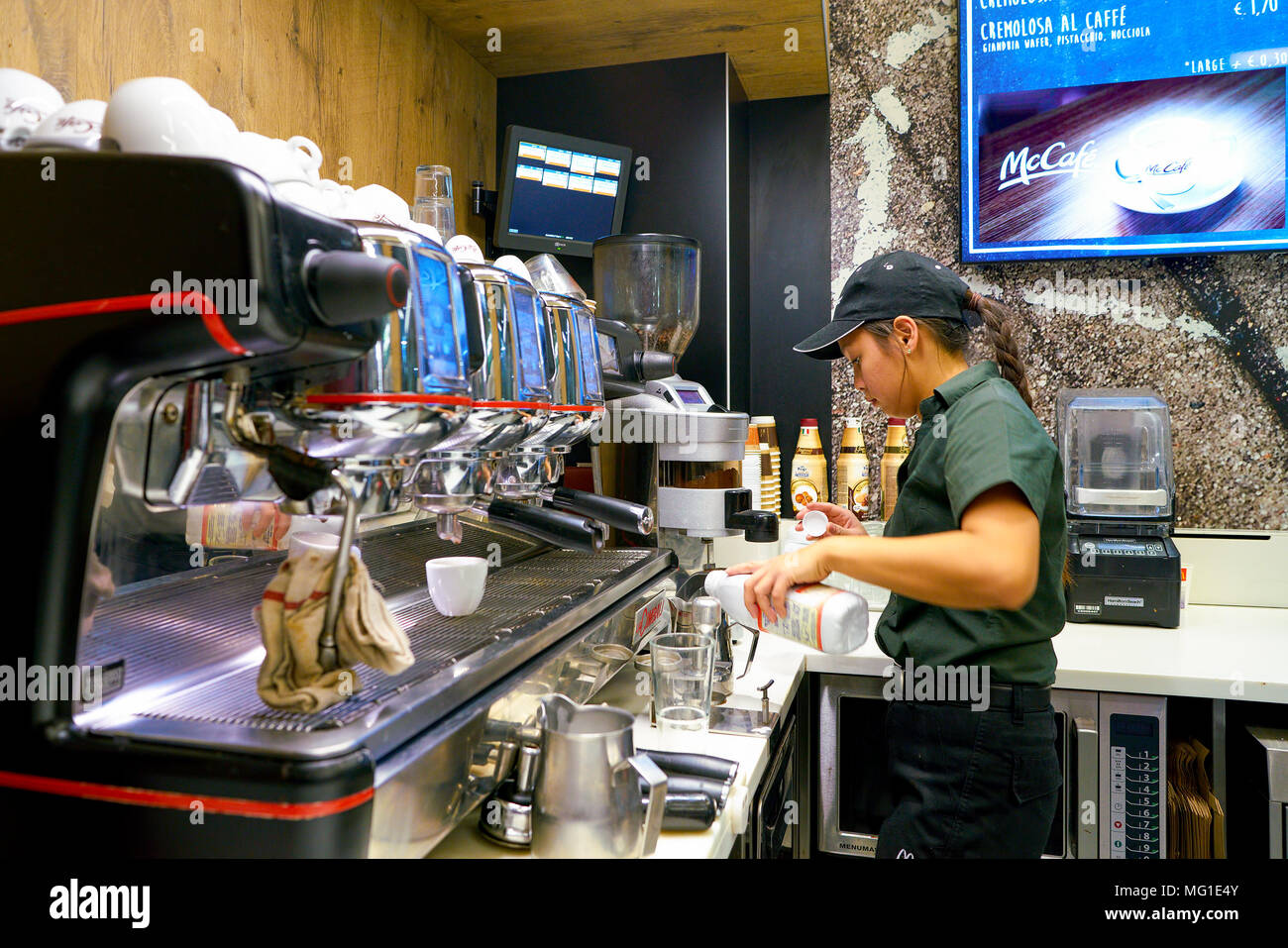 MILAN, ITALY - CIRCA NOVEMBER, 2017: worker at a McCafe coffee shop ...