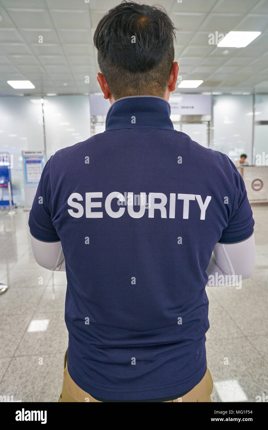 BUSAN, SOUTH KOREA - CIRCA MAY, 2017: airport security staff at Gimhae ...