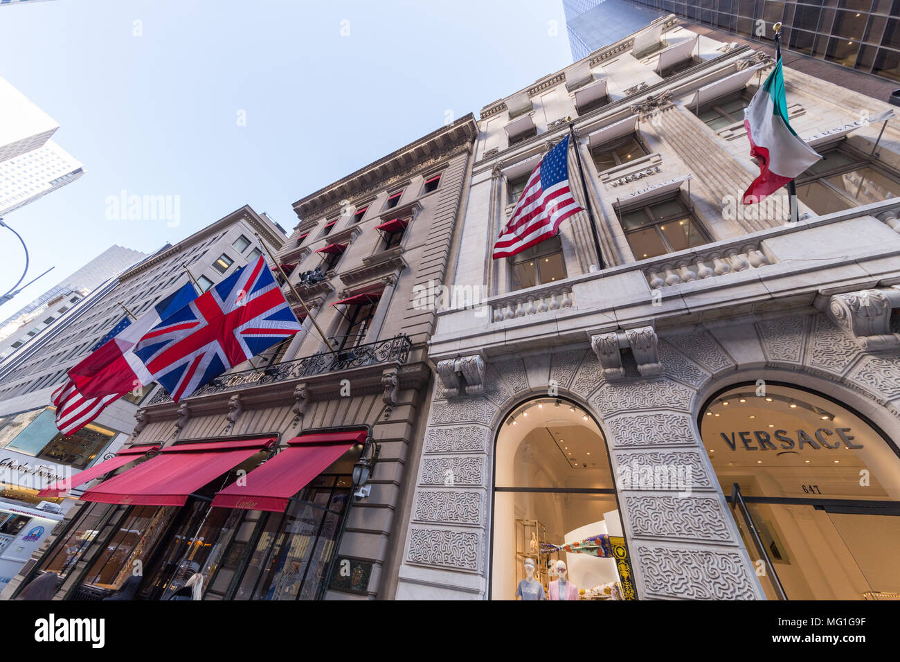 Flags hanging on building, Manhattan NYC Stock Photo - Alamy