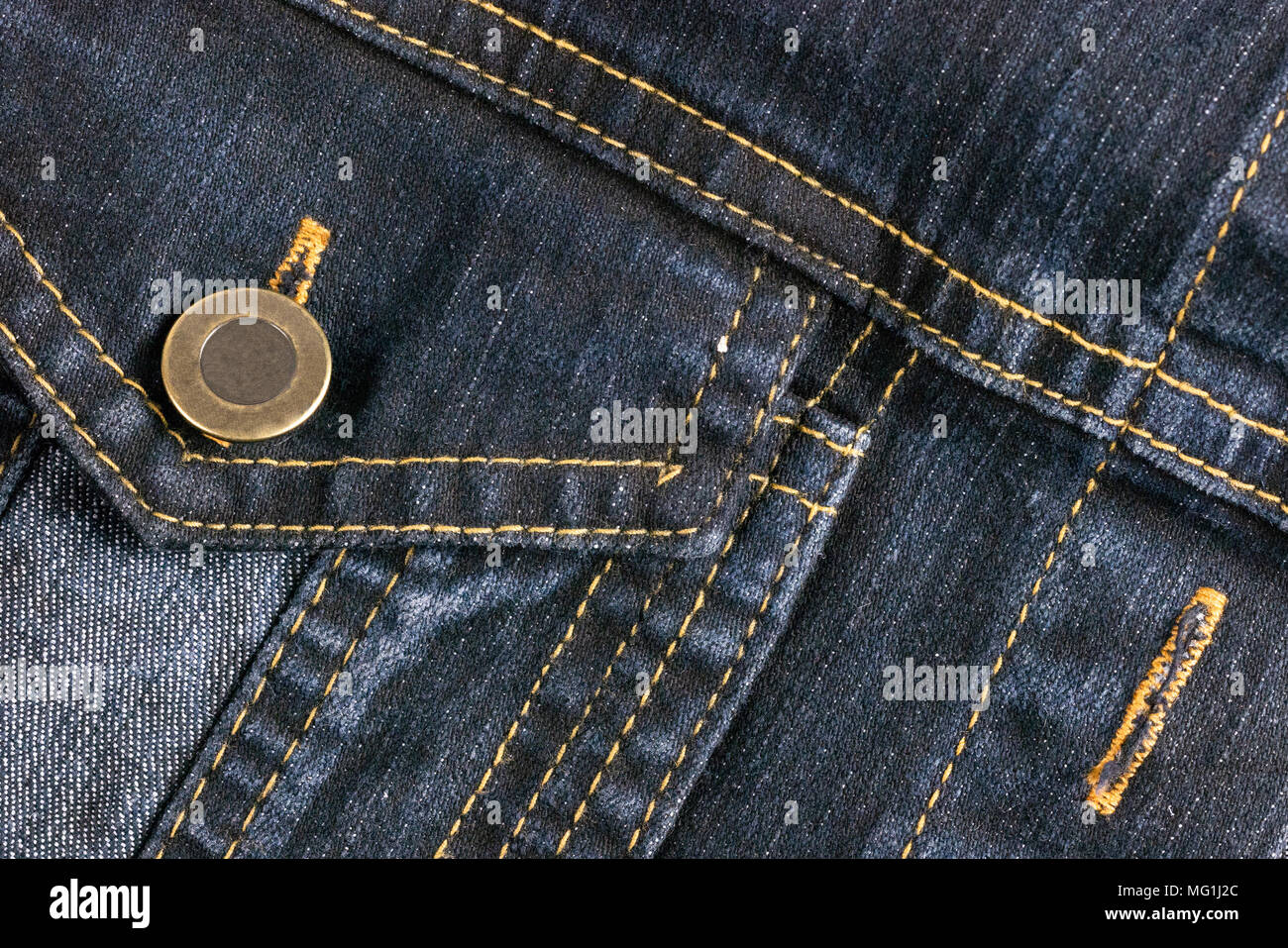 Abstract background and texture of denim jeans and buttoned on pocket ...