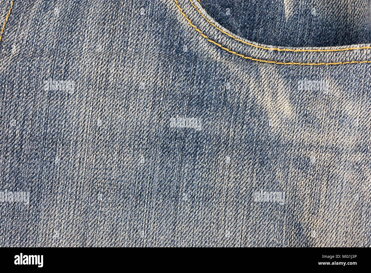 Abstract background and texture of jean. Denim sewn with yellow thread ...