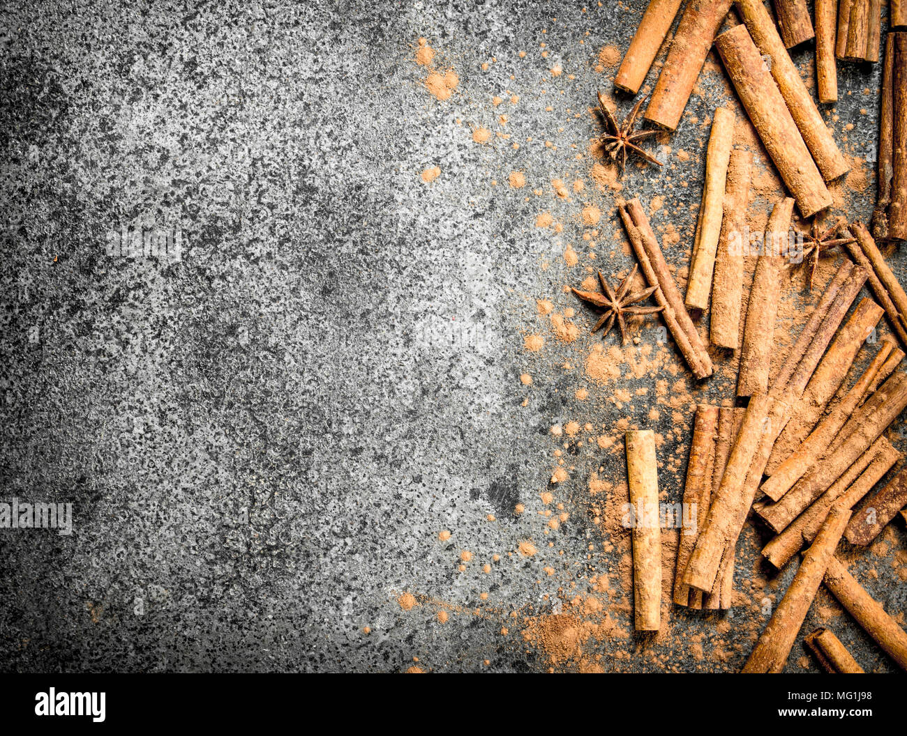 Cinnamon sticks. On a rustic background Stock Photo - Alamy