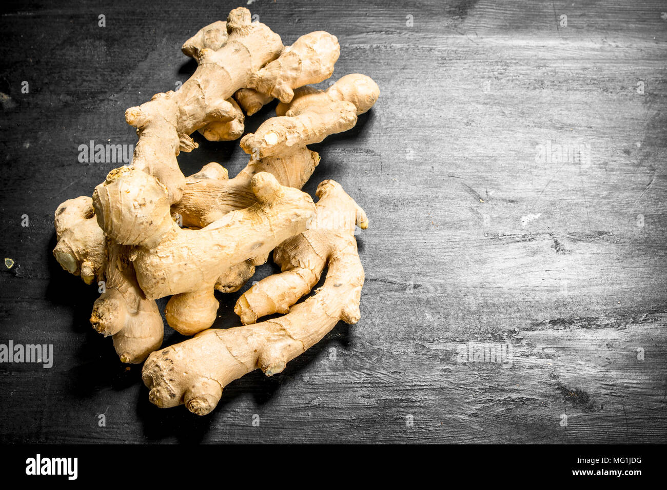 Fresh ginger. On the black chalkboard Stock Photo - Alamy