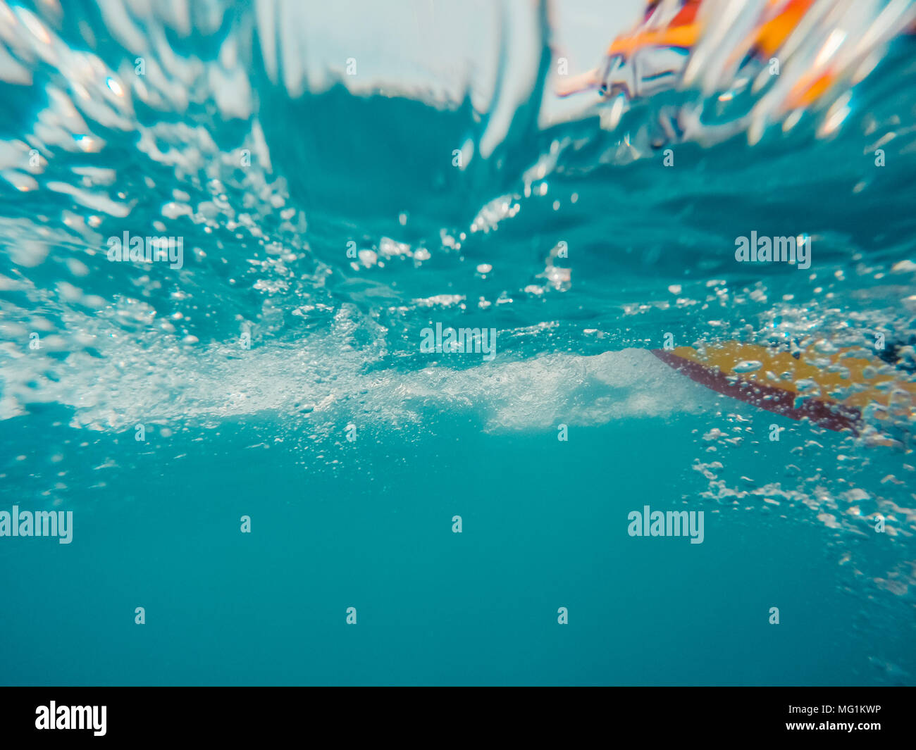 Underwater view of a moving inflatable ring that floating in the water ...