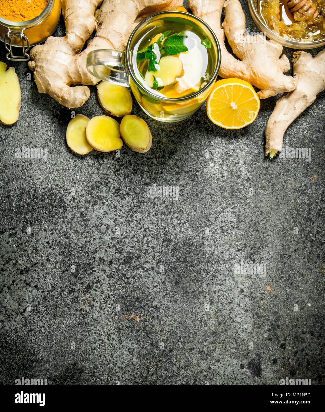 Ginger tea with mint and honey. On rustic background Stock Photo - Alamy
