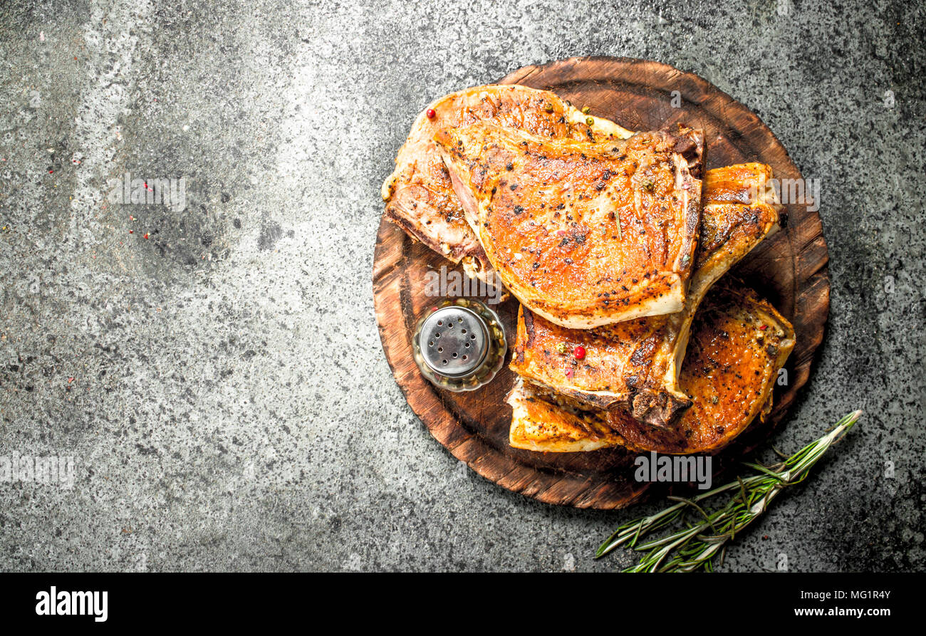 The pork steak with spices. On rustic background Stock Photo - Alamy