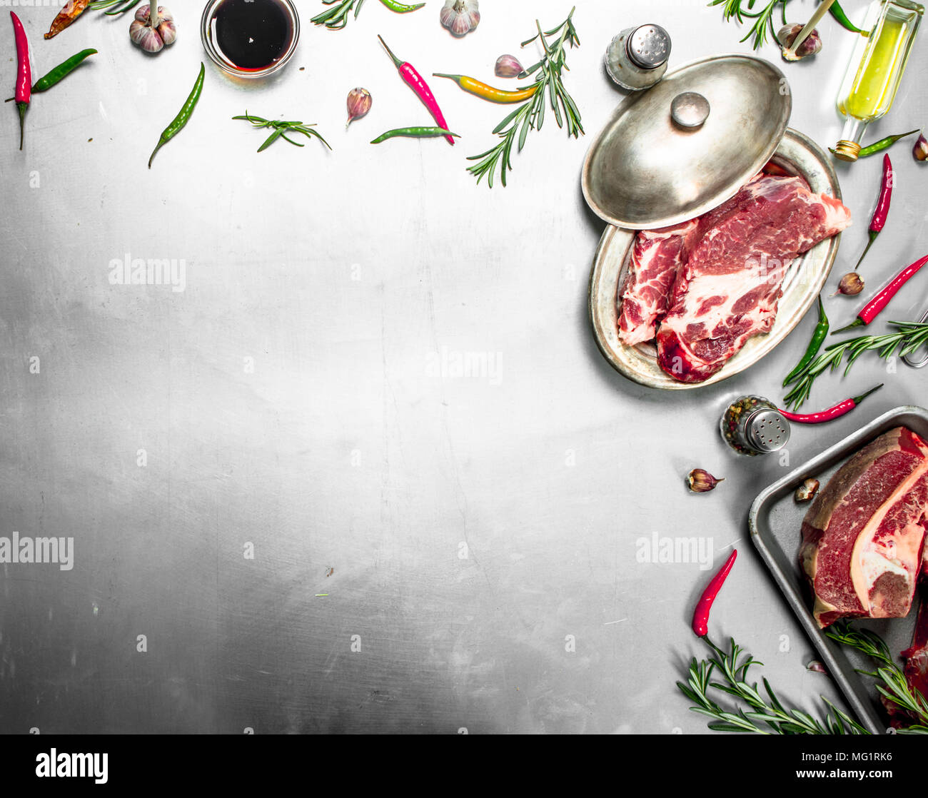 Fresh raw beef steak with spices. On rustic background Stock Photo - Alamy